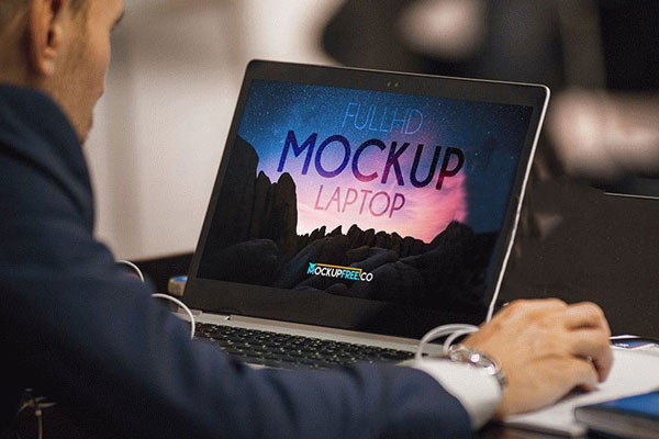 Mockup Featuring a Man Working on Laptop Free Download | Resource Boy