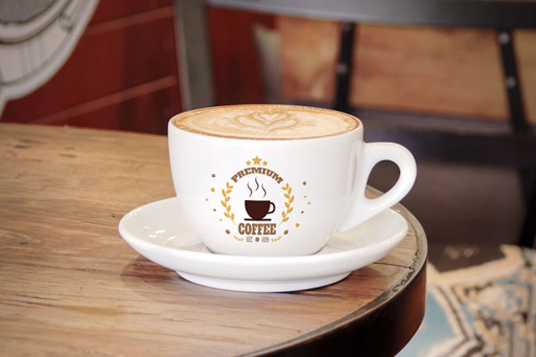 Small Coffee Cup on a Wooden Table Mockup Free Download | Resource Boy