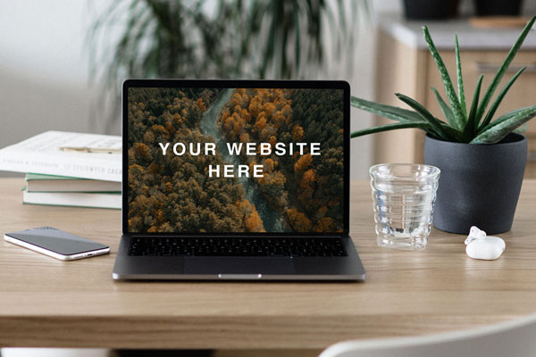 Mockup of a Front View MacBook Pro on Table Free Download | Resource Boy