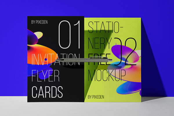 2 Flyers Mockup Standing Against the Wall with a Pen Free Download ...