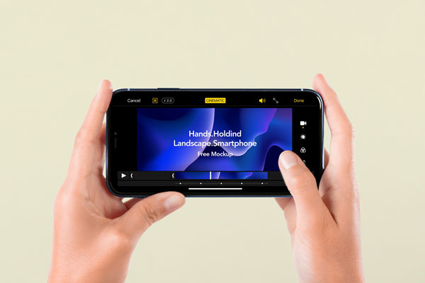 Front View of a Hand-Holding Landscape Smartphone Screen Mockup Free ...