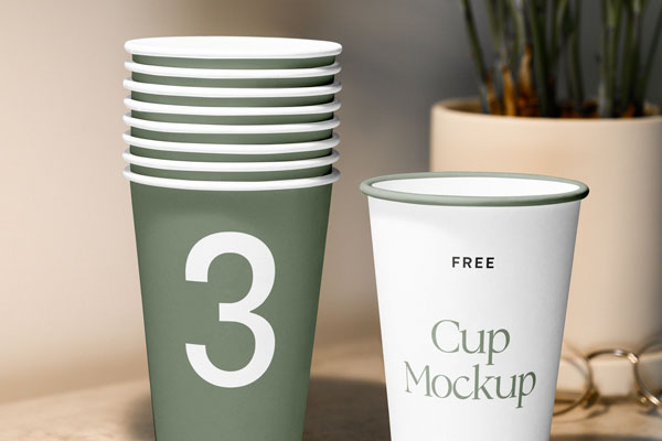 Front View of Realistic Paper Cups Mockup on Table Free Download | Resource Boy