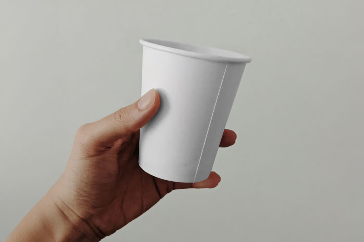 Paper Coffee Cup in Hand Mockup Free Download | Resource Boy